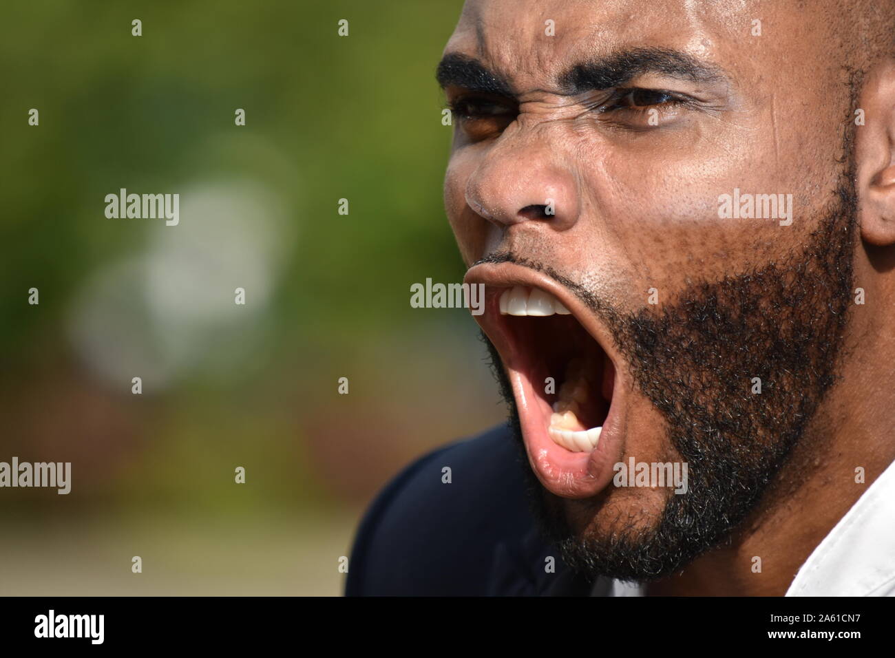 An Unshaven Black Male Yelling Stock Photo - Alamy