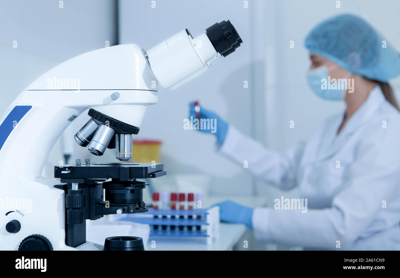 Woman scientist preparing samples with blood for researching Stock ... Woman scientist preparing samples with blood for researching Stock ...