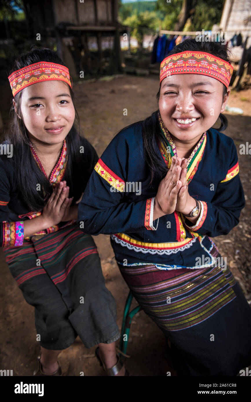 Khmu girls in traditional attire proudly pose in a rural village in ...