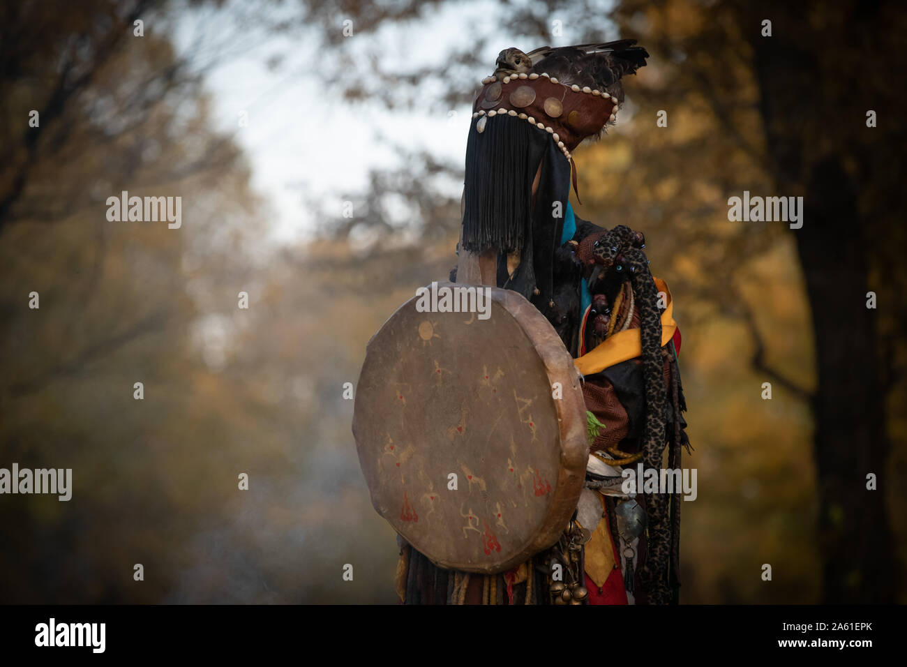 Mongolian traditional shaman performing a traditional shamanistic ...