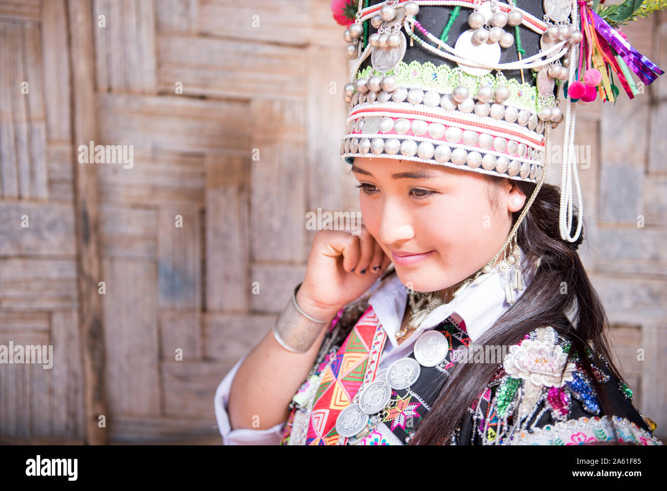 An Akha girl in traditional attire joins the Hmong festival ...