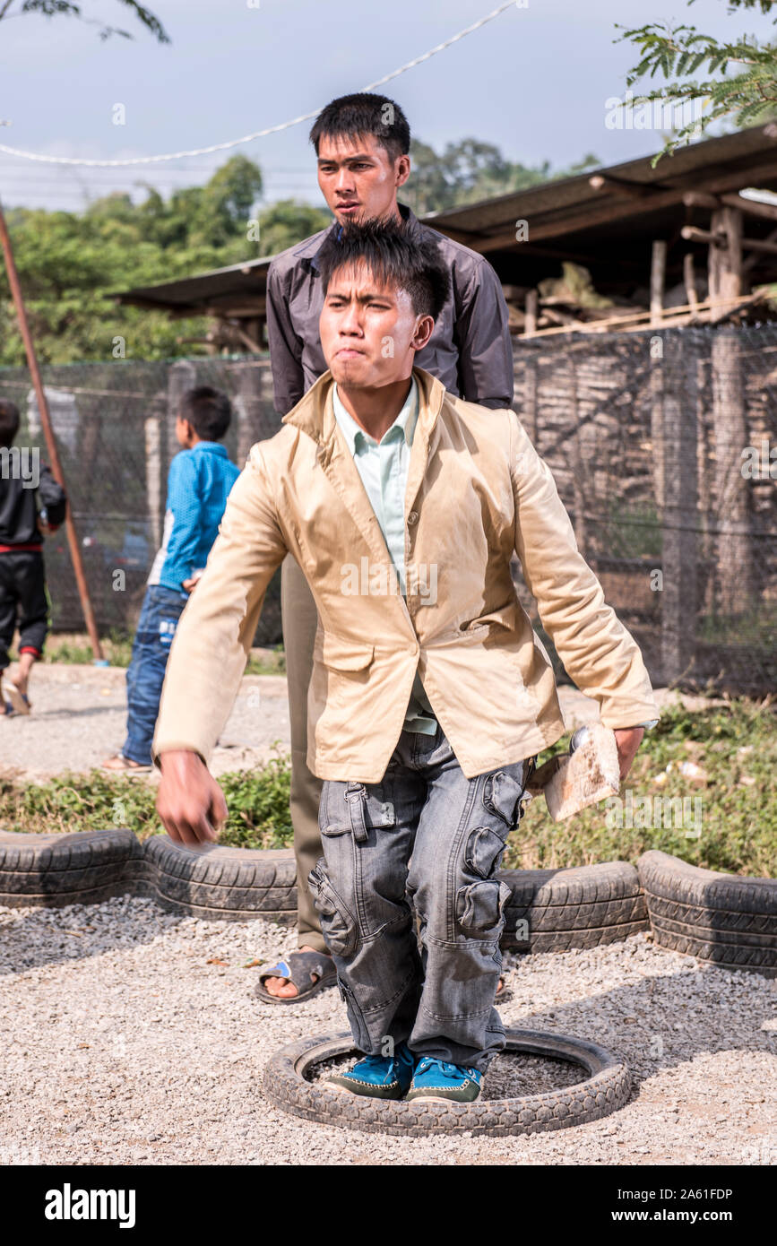 Men participate in a traditional ball-throwing game at a Hmong festival ...