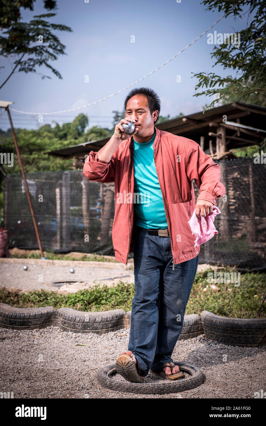 Men participate in a traditional ball-throwing game at a Hmong festival ...