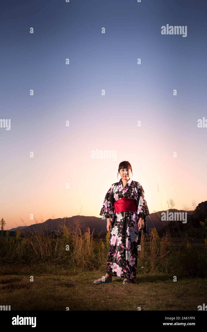 A serene moment at Irino Beach in Shikoku, where a woman in a ...