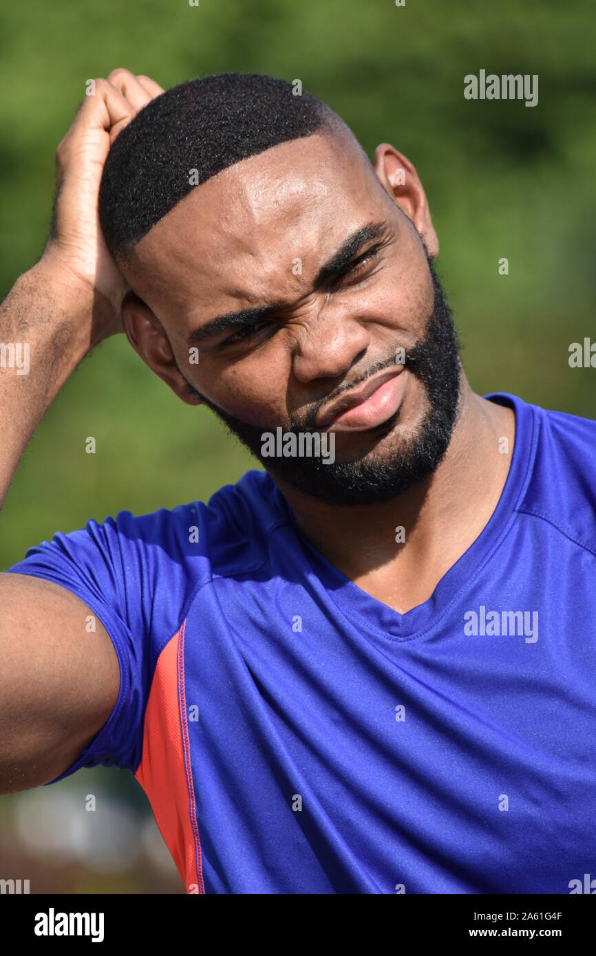 Confused Male Athlete Stock Photo - Alamy