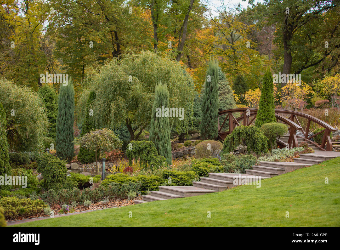 small bridge and green plants, landscape park Stock Photo - Alamy