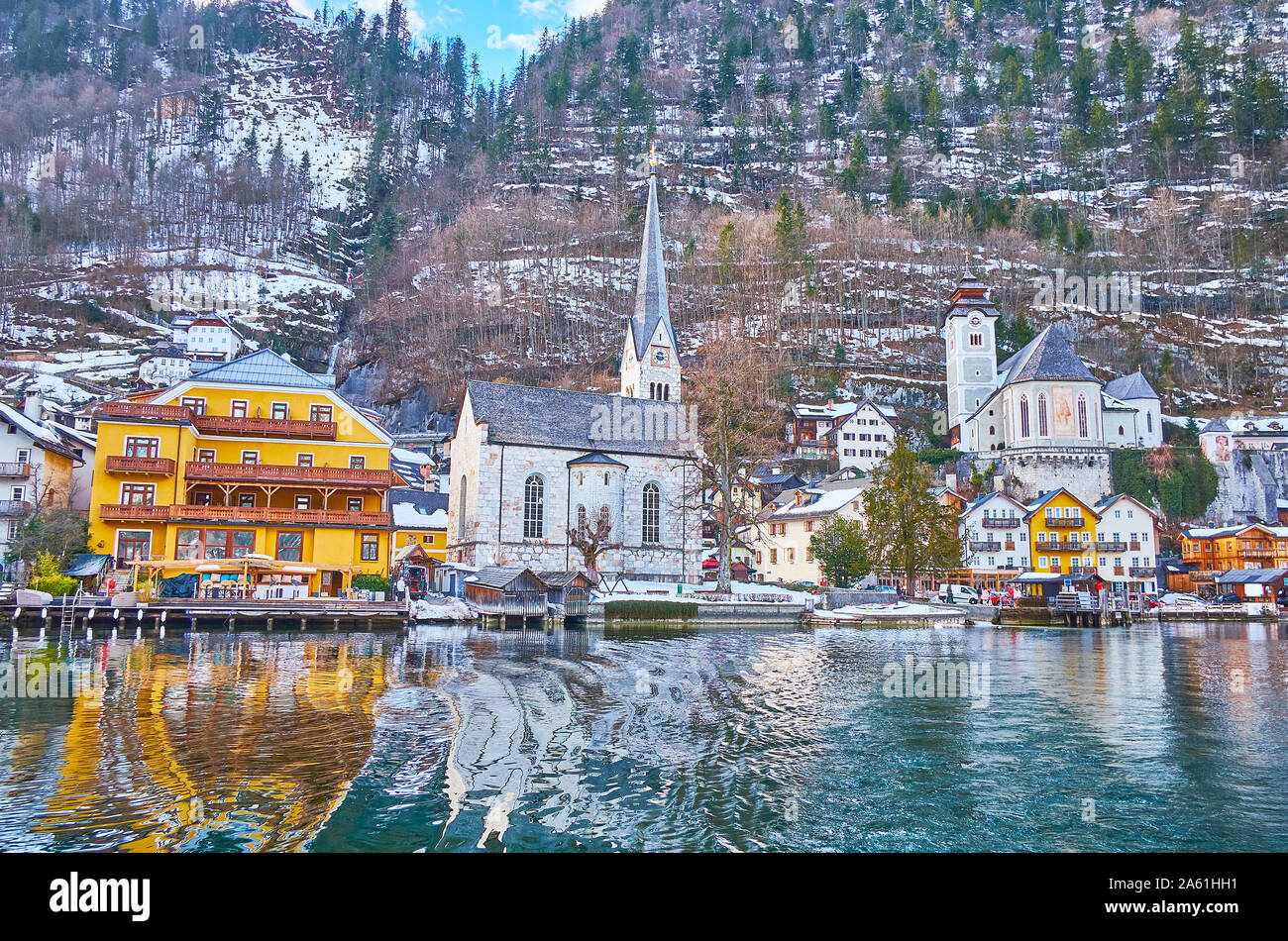 The cityscape of Hallstatt with its historical buildings and two ...