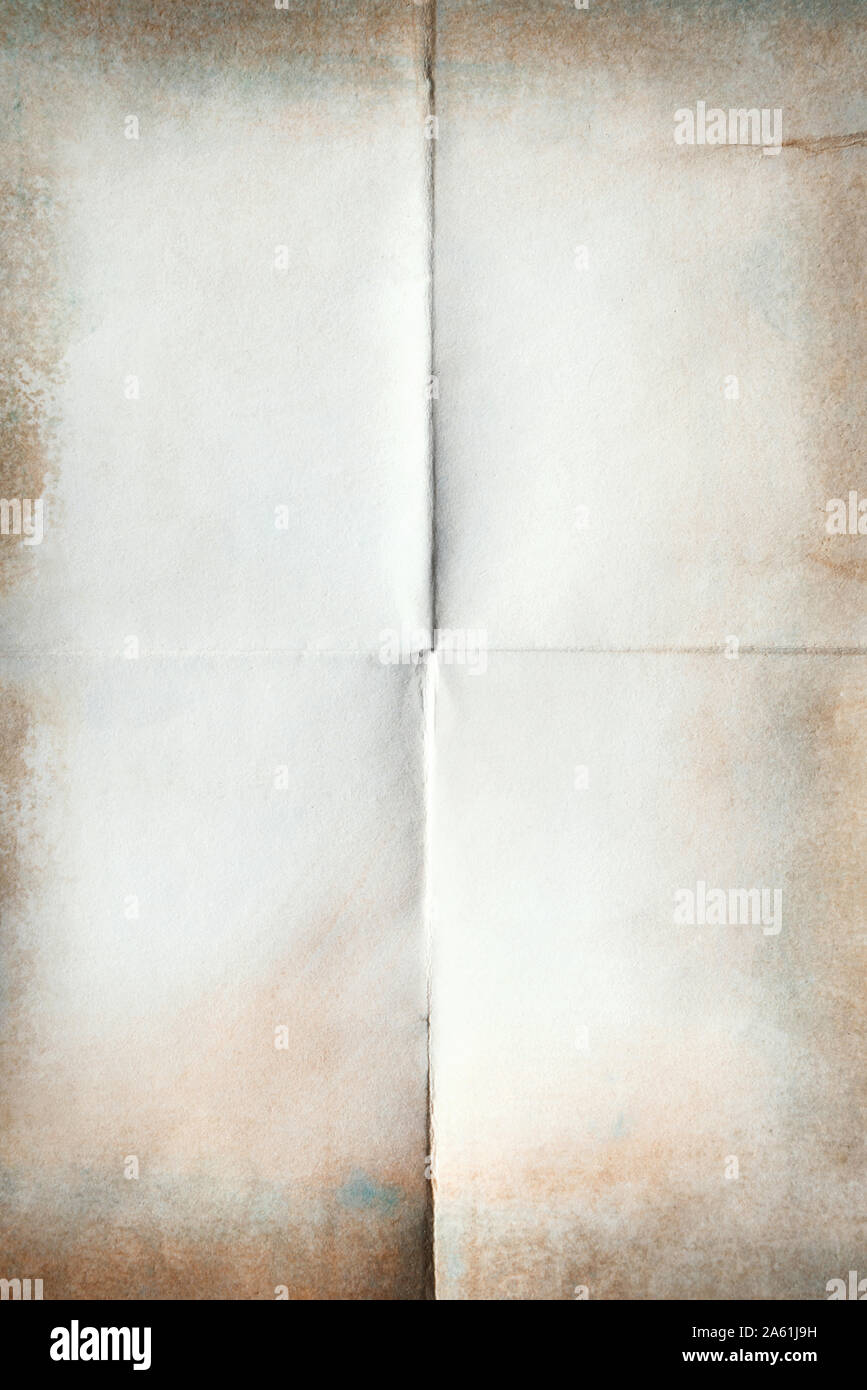 Close-up of old paper folded in four texture background Stock Photo - Alamy