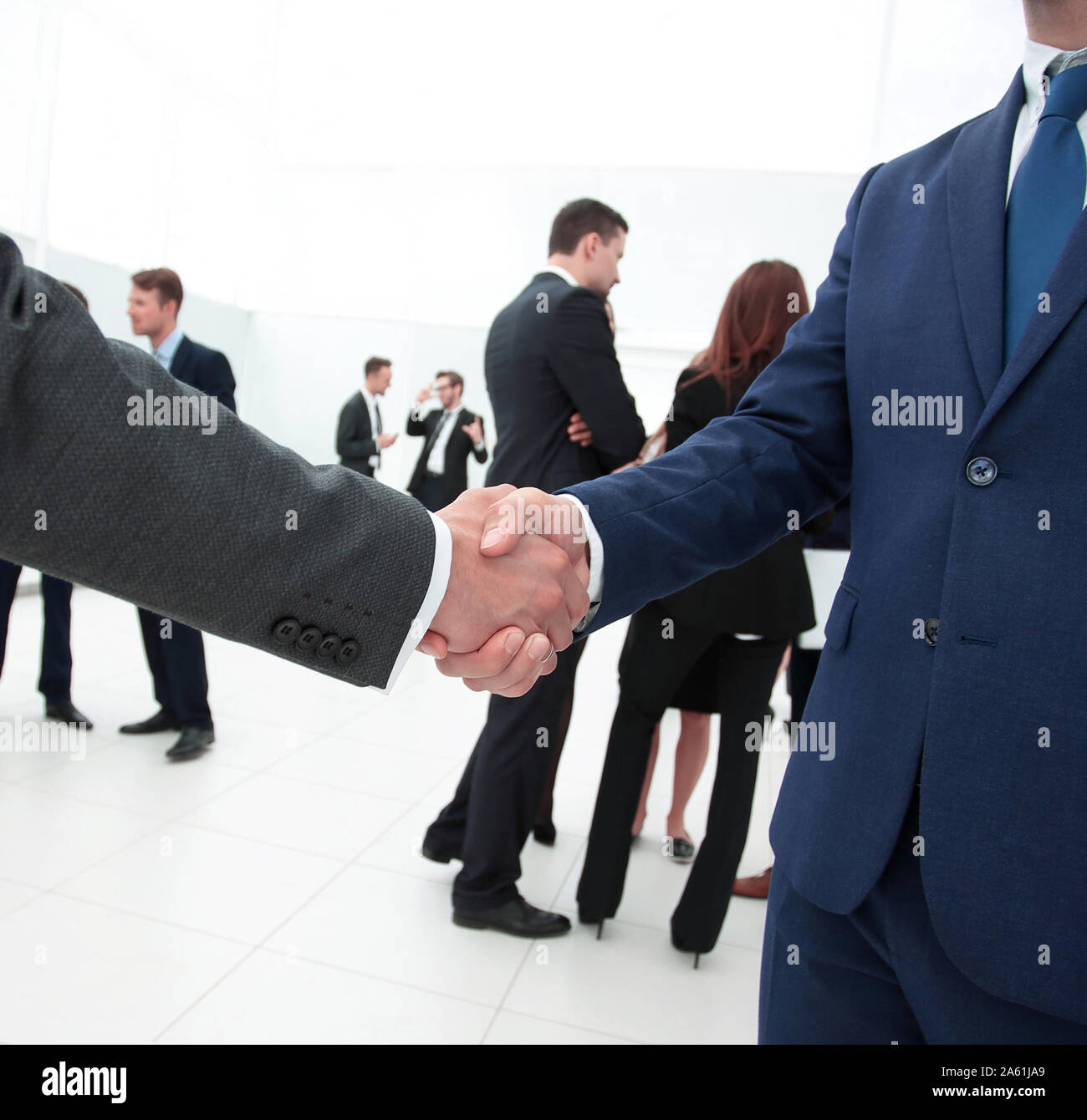 closeup of handshake of business partners on the background of business ...