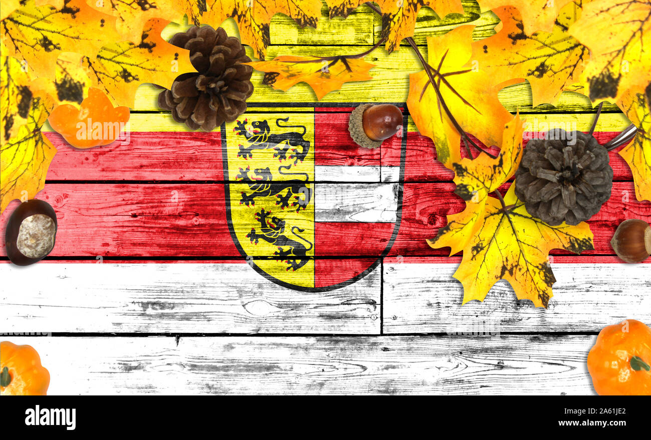 Carinthia flag on autumn wooden background with leaves and good place ...