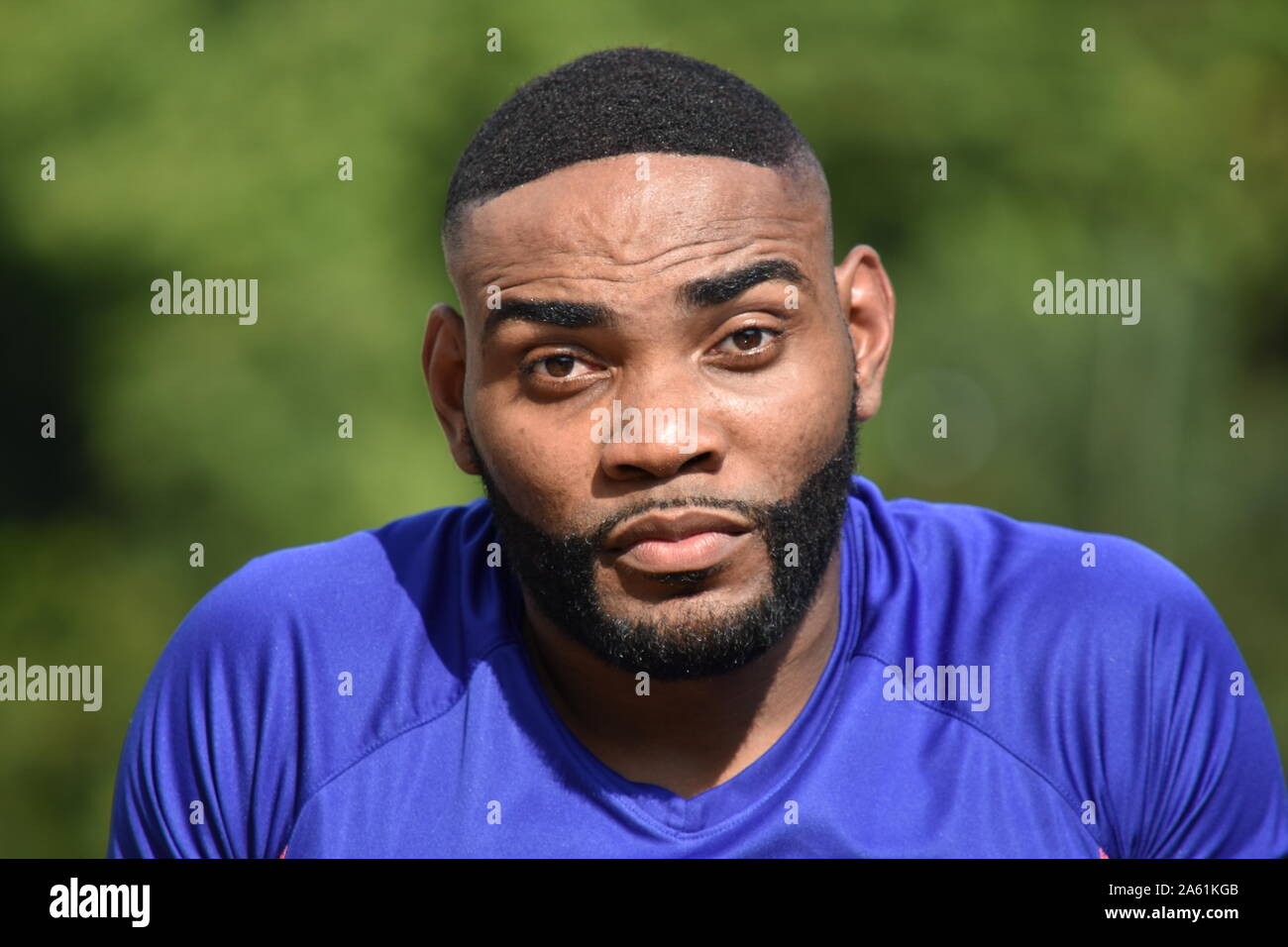Confused Male Athlete Stock Photo - Alamy