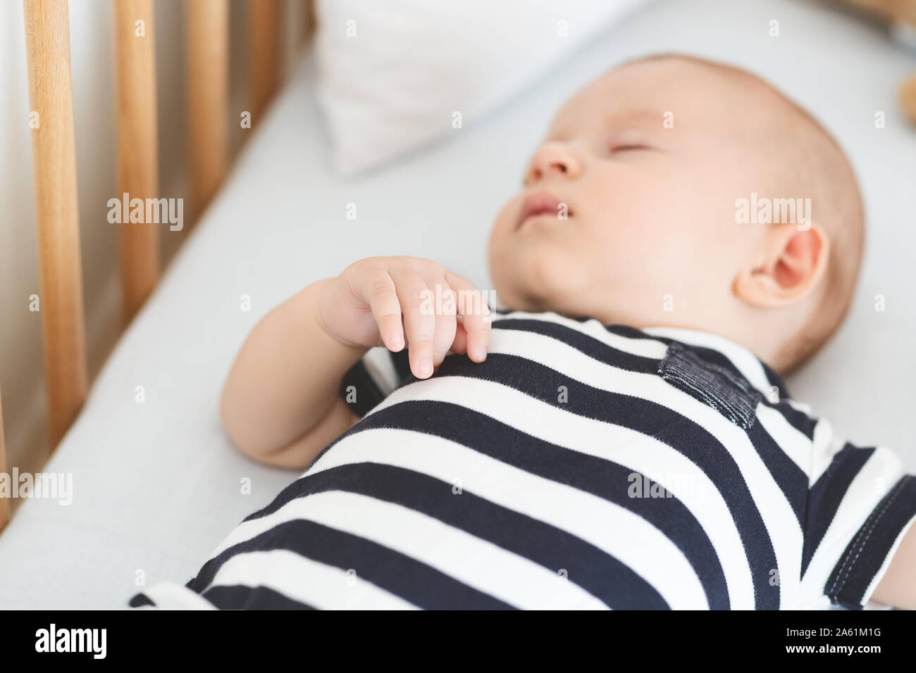 Closeup of cute newborn baby sleeping in his cradle Stock Photo - Alamy