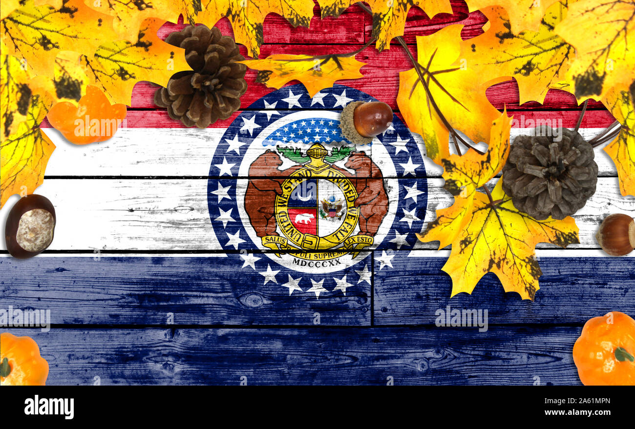 State of Missouri flag on autumn wooden background with leaves and good ...