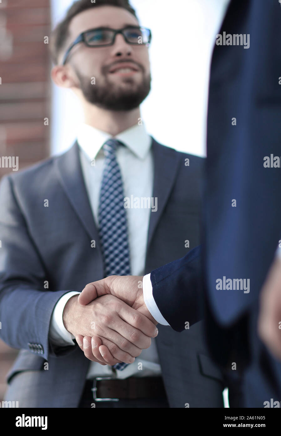 Business men giving a handshake. Business concept Stock Photo - Alamy