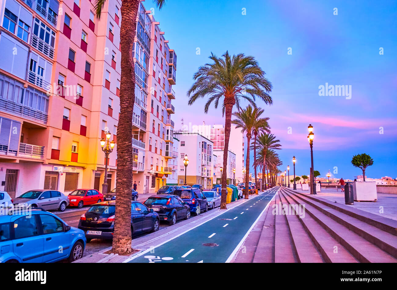 The leisure walk along the promenade of Cadiz resort and enjoying ...