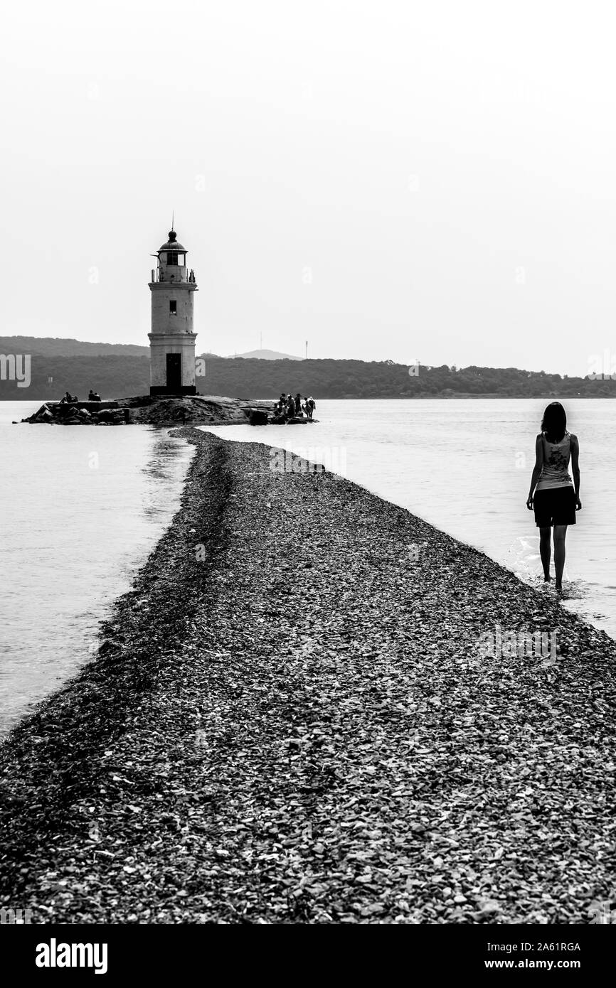 Vladivostok, Russia - July 30, 2015: Young girl is walking to the ...