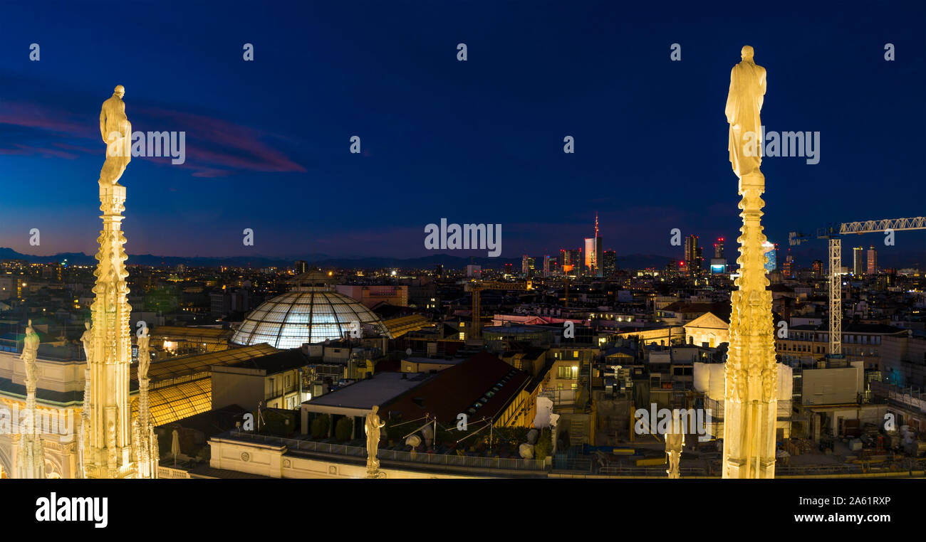 Aerial view of Milan skyline by night from Duomo (cathedral) roof ...