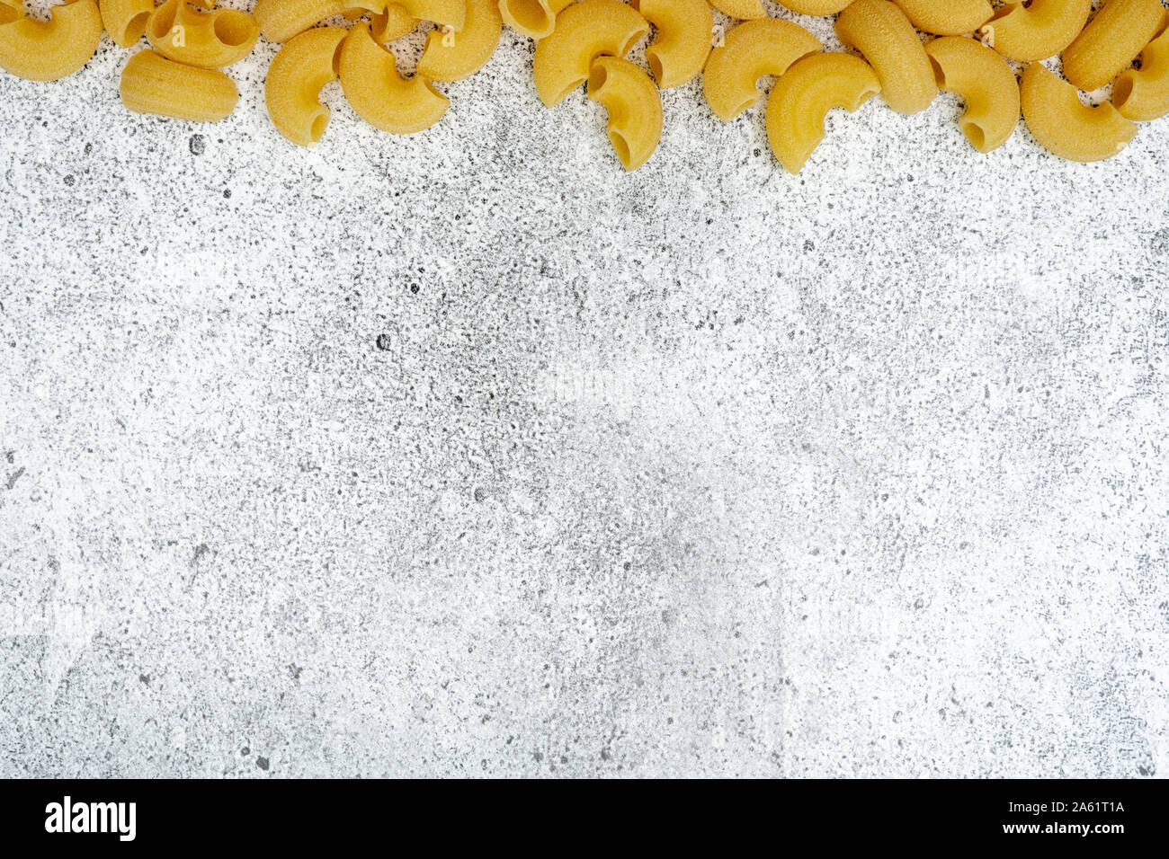 Types of uncooked pasta. Chifferi grandi pasta uncooked on a light ...