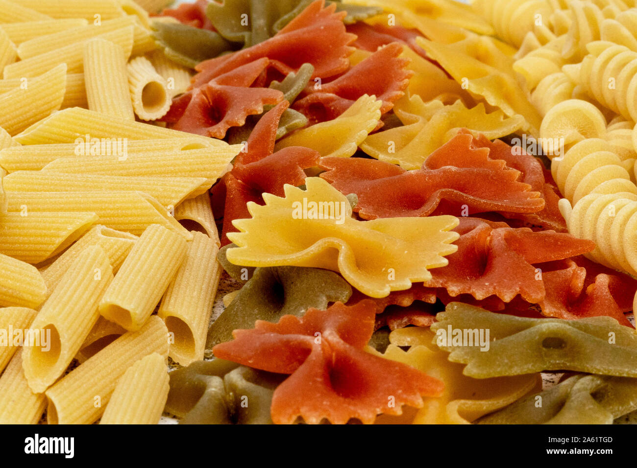 Types of uncooked pasta. Pasta penne, fusilli, color farfalle dry. Flat ...