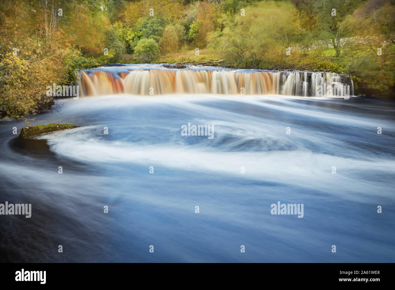 Wain Wath Force in autumn. A popular waterfall on the river swale near ...