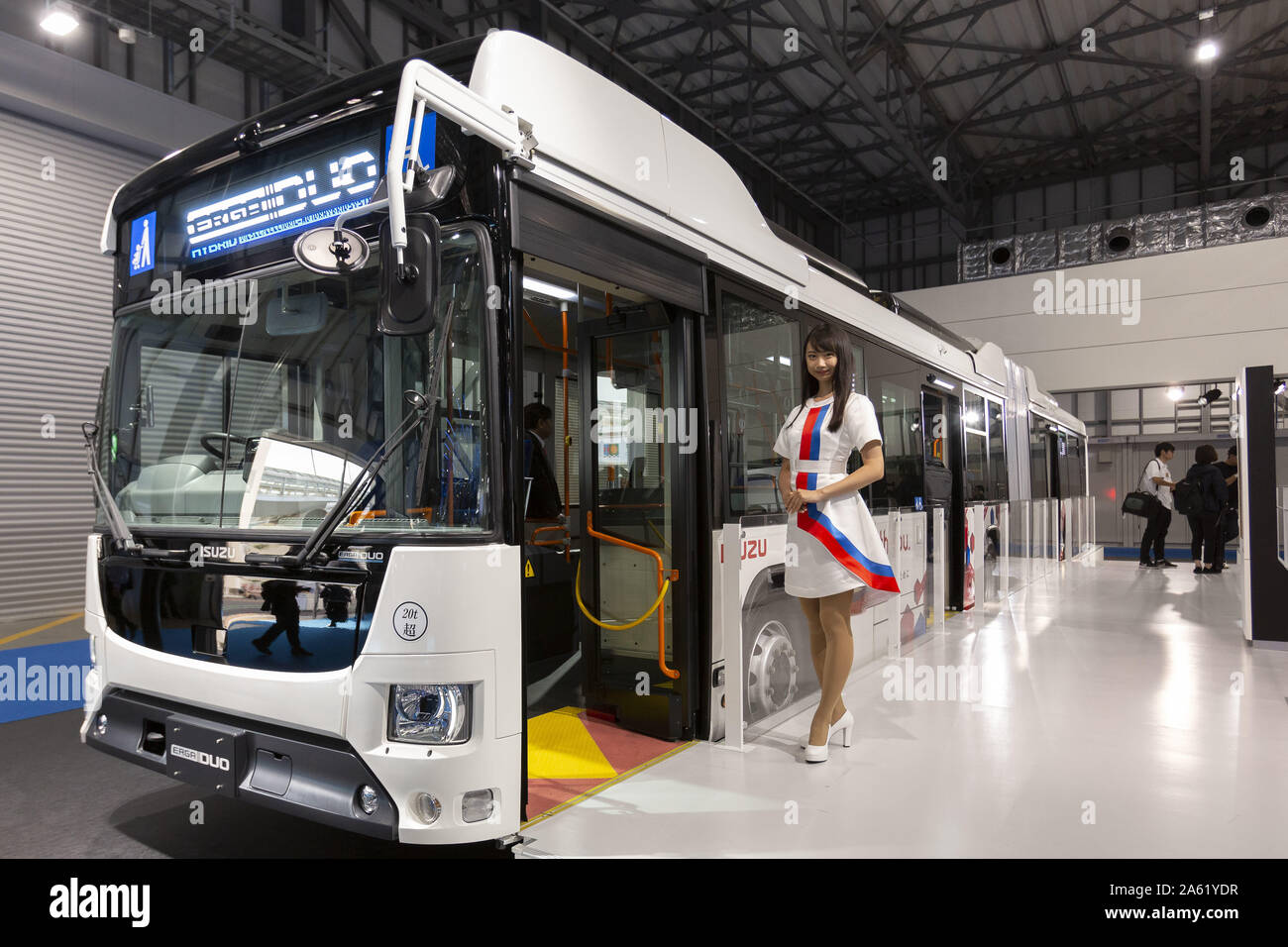 Tokyo, Japan. 23rd Oct, 2019. A booth assistant poses for a photograph ...