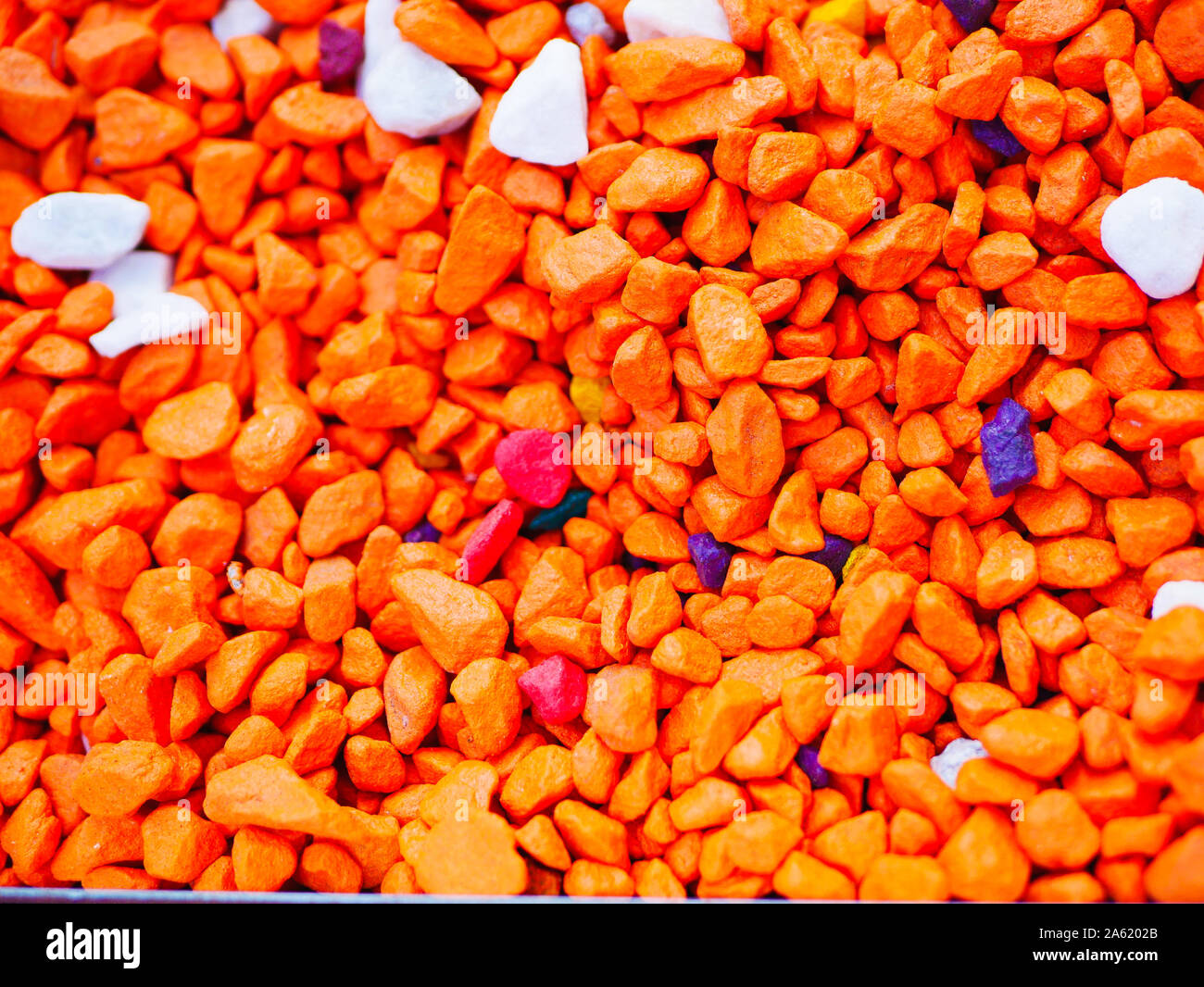 orange little pebbles. Background composed of small orange pebbles ...