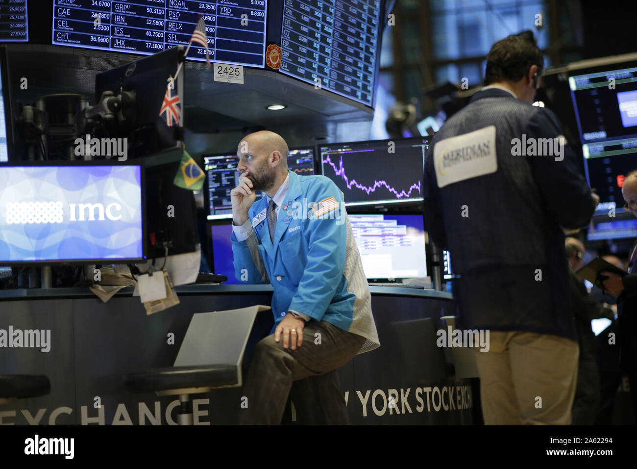 New York, United States. 23rd Oct, 2019. Traders work on the the floor ...