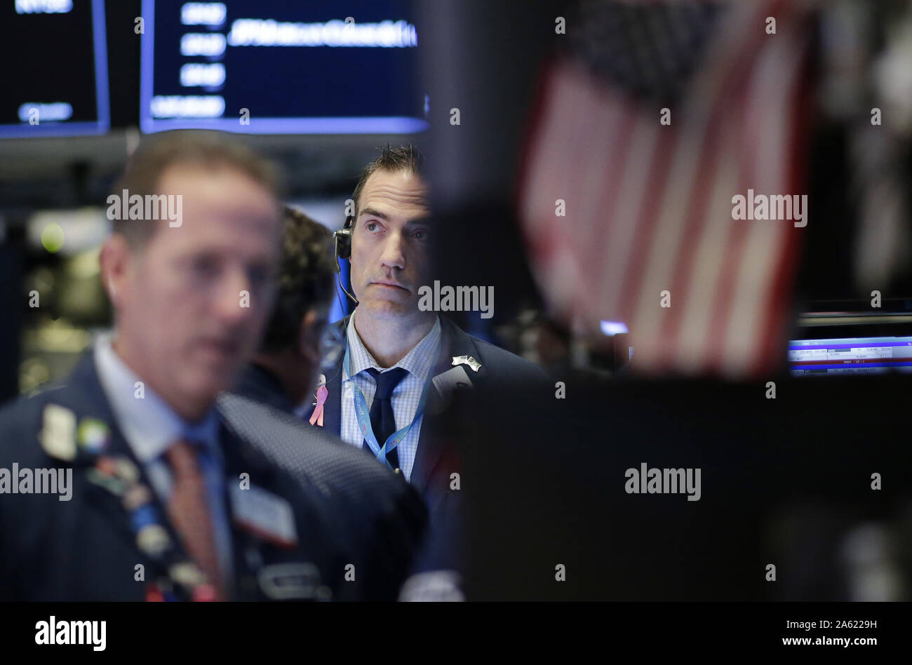 New York, United States. 23rd Oct, 2019. Traders work on the the floor ...