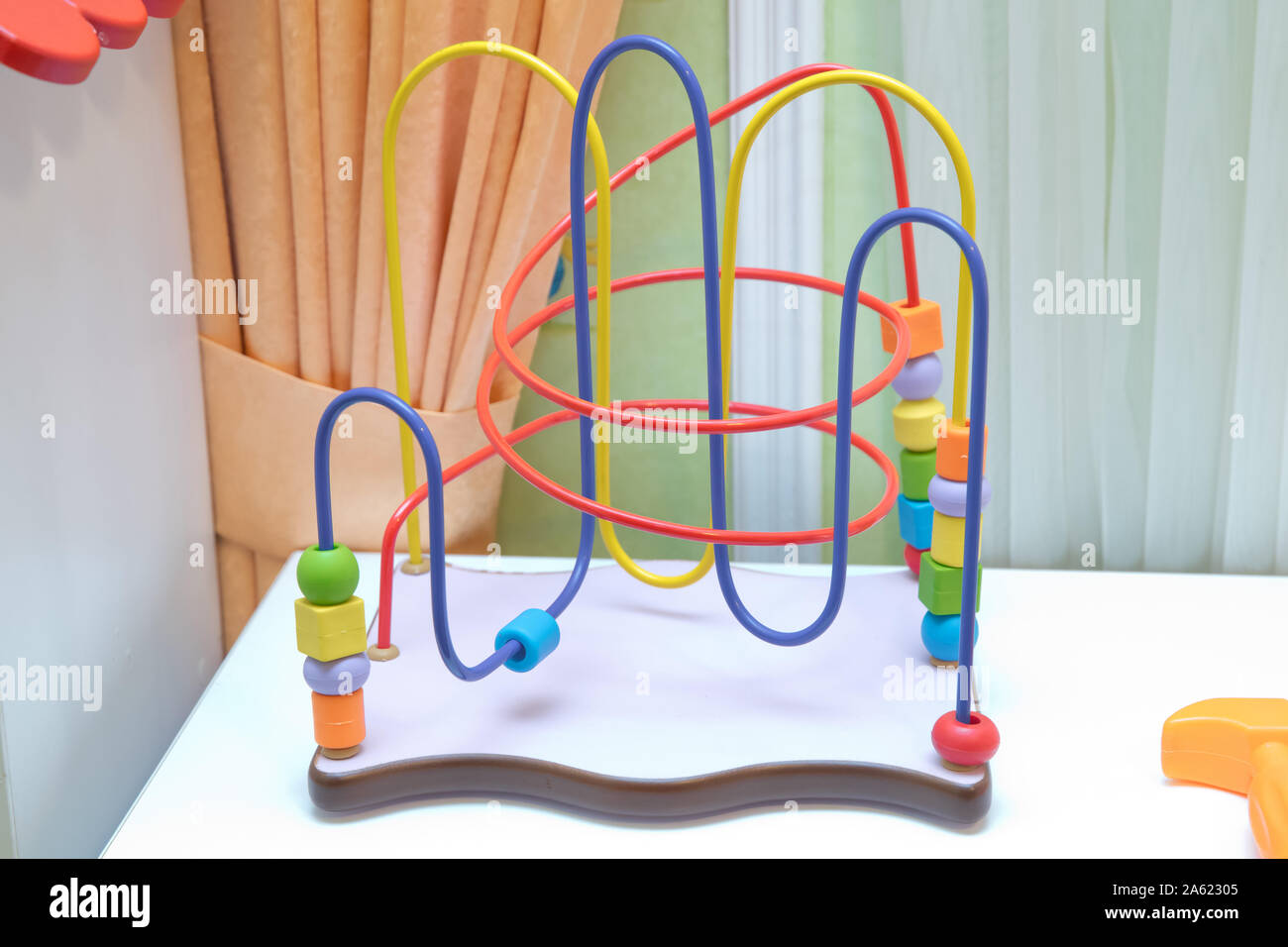 Picture of a Classic Toy for Young Child . A child's bead roller ...