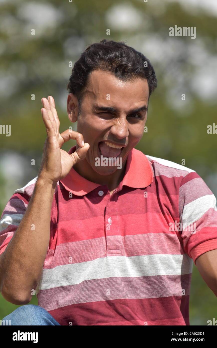 Hispanic Male And Okay Sign Stock Photo - Alamy