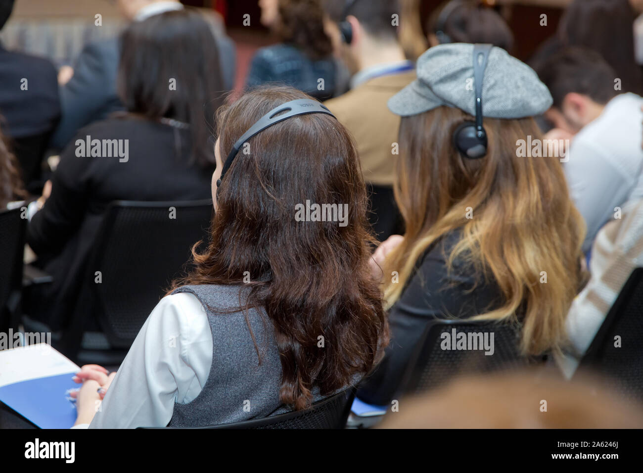 Man with headset at the conference .head phone for online translation ...