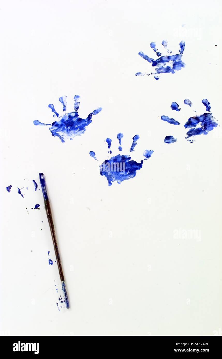 A child's small handprint in blue paint on a white background Stock ...