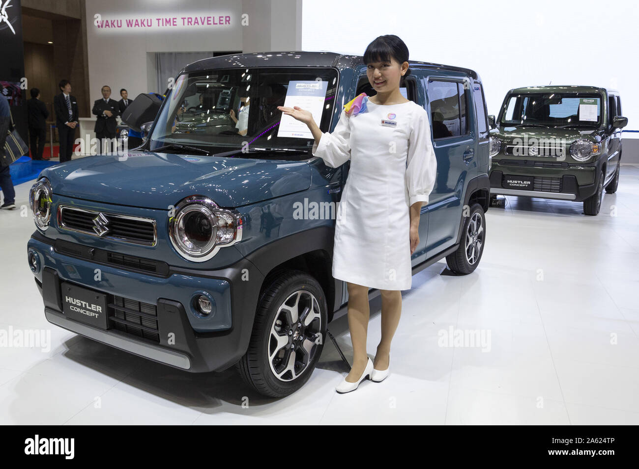 Tokyo, Japan. 23rd Oct, 2019. A booth assistant poses for a photograph ...