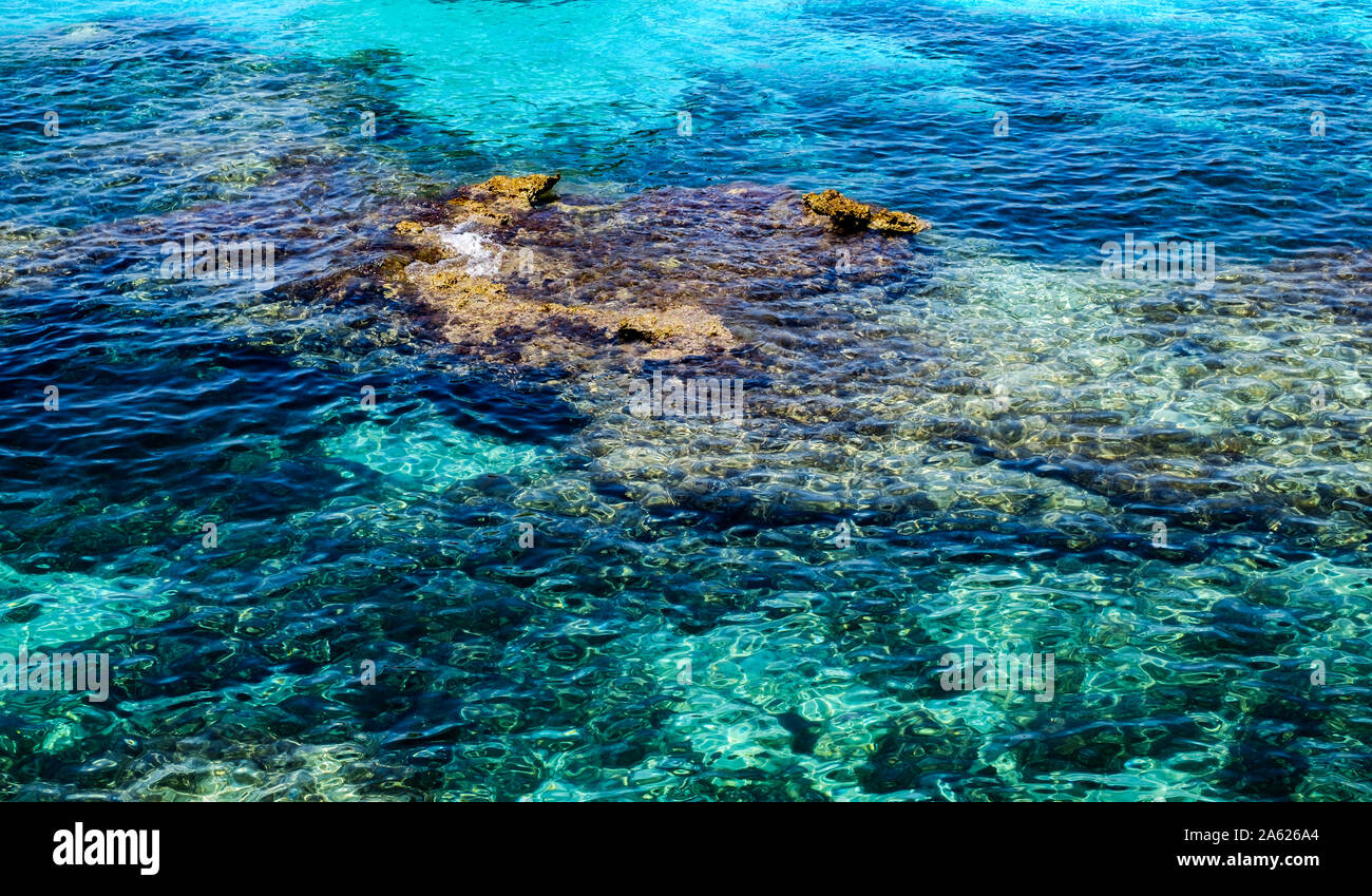 Rocks in the clear Mediterranean sea water Stock Photo - Alamy