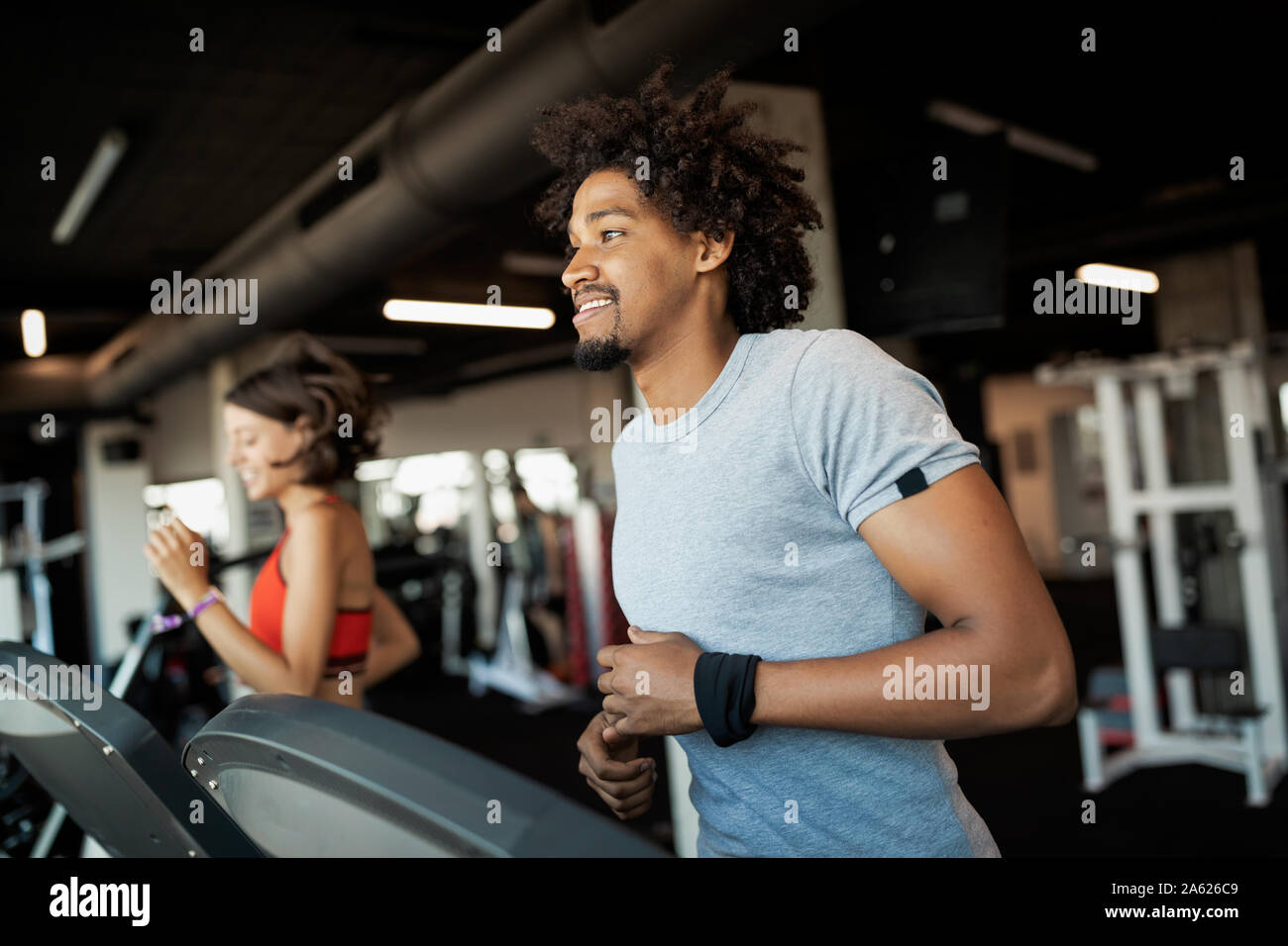 Group of young people running on treadmills in modern sport gym Stock ...
