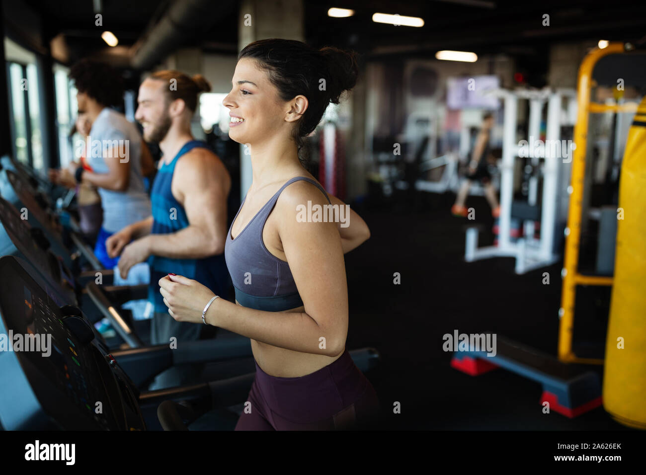 Picture of people running on treadmill in gym Stock Photo - Alamy
