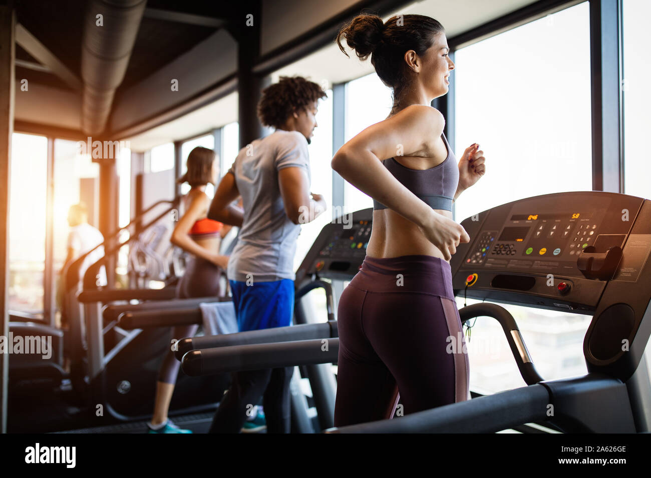 Picture of people running on treadmill in gym Stock Photo - Alamy