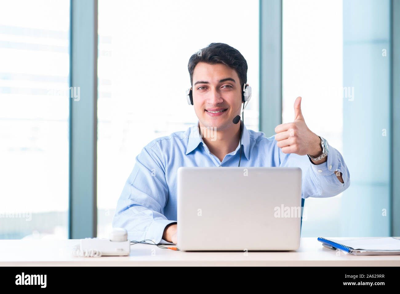 Call center giving thumbs up hi-res stock photography and images - Alamy