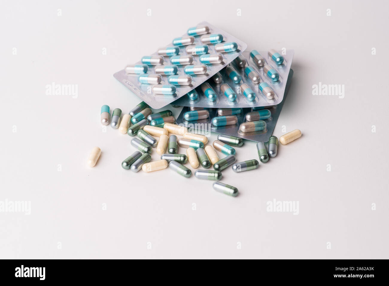 Spilled tablets, capsules, medicaments and syringes with needles and ...