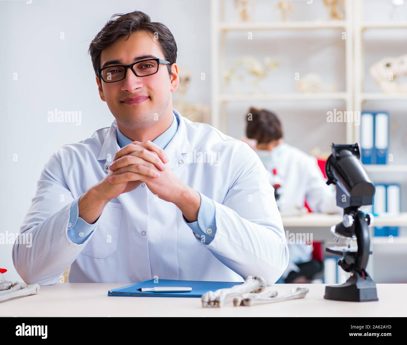 The professor studying human skeleton in lab Stock Photo - Alamy