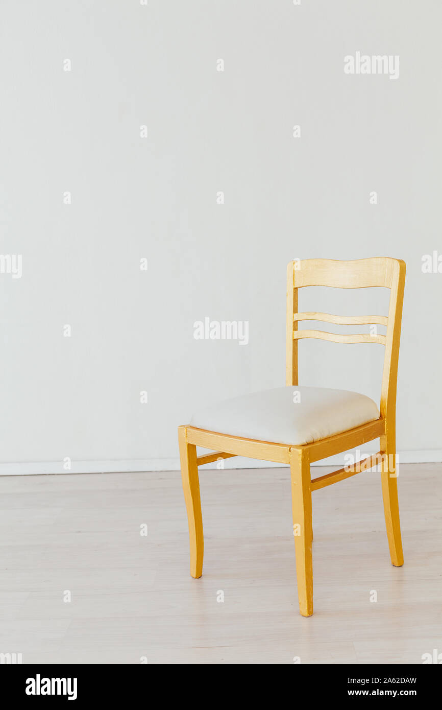 one chair in the interior of an empty white room Stock Photo - Alamy