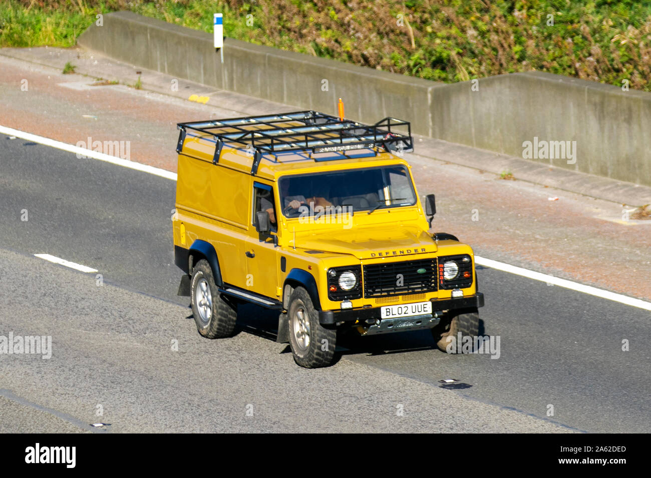 2002 yellow Land Rover Defender 110 TD5; UK Vehicular traffic ...