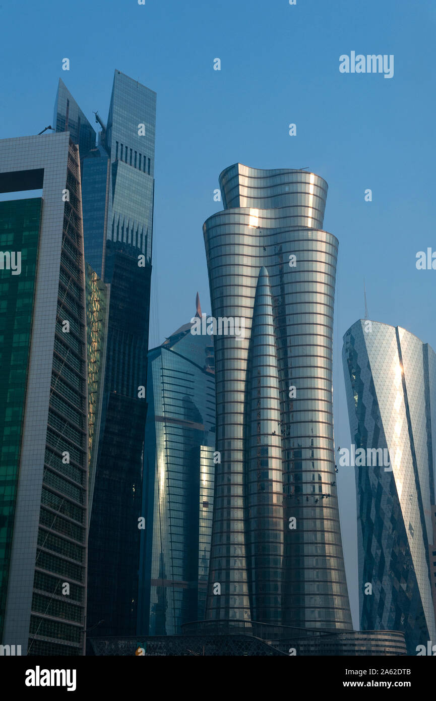 Modern glass fronted skyscrapers and office towers line the Doha ...
