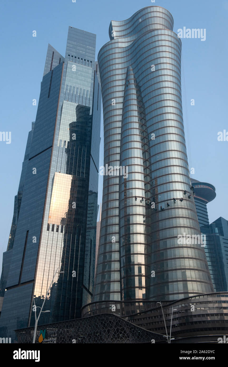 Modern glass fronted skyscrapers and office towers line the Doha ...