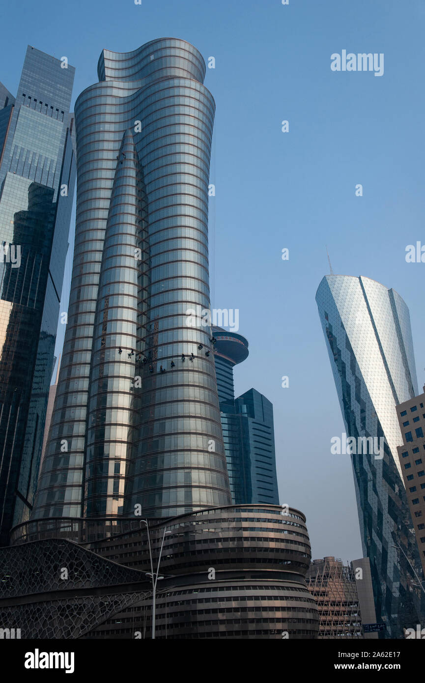Modern glass fronted skyscrapers and office towers line the Doha ...