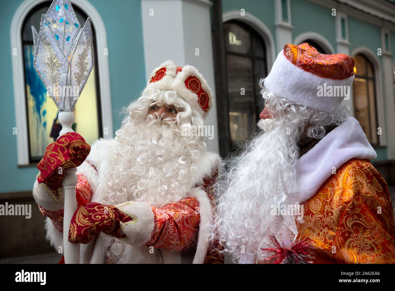 people in the costume of Ded Moroz talking to each other on the street ...