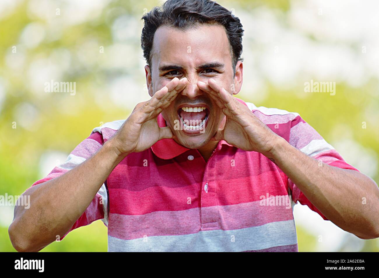 Colombian Male Shouting Stock Photo - Alamy
