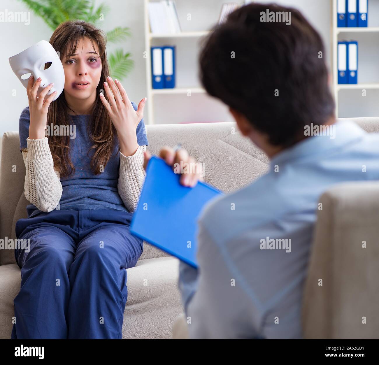 The woman suffering from home violence visiting doctor Stock Photo - Alamy