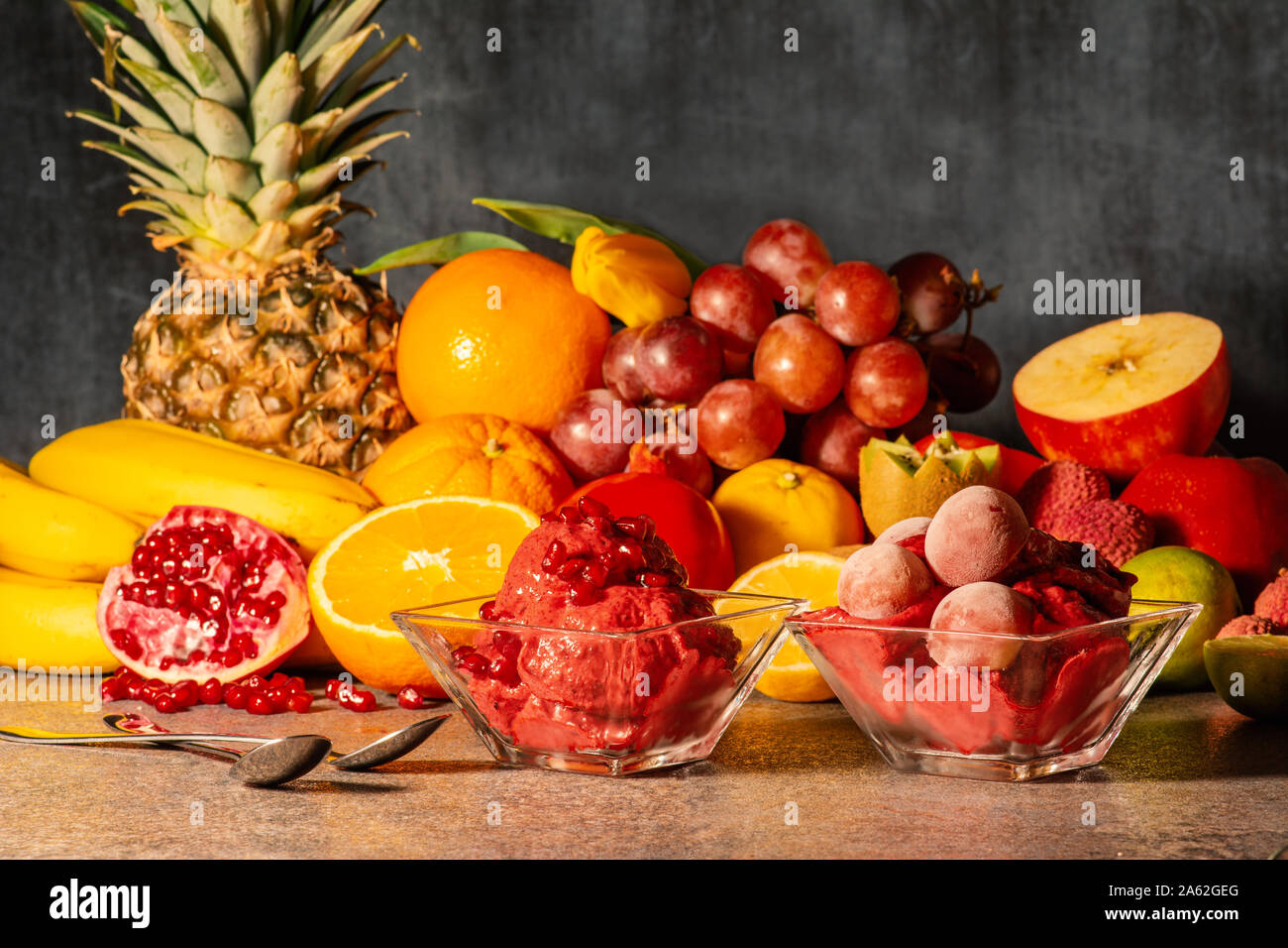 Forest fruit ice cream with a juicy red color, in transparent bowls ...