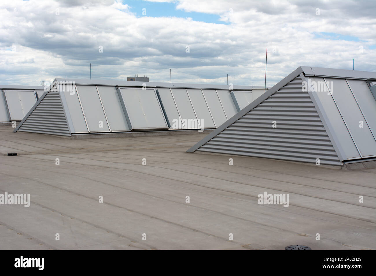 Flat roof with many large skylights and hydro insulation membranes on ...